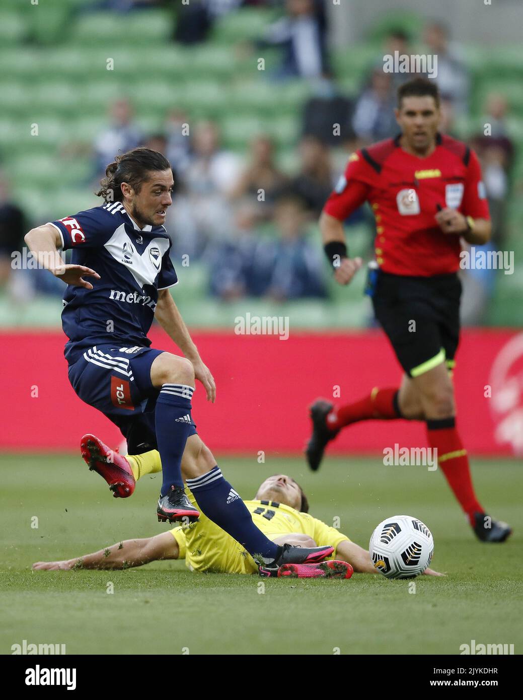 Marco Rojas of the Victory is tackled by Mirza Muratovic of the Phoenix ...