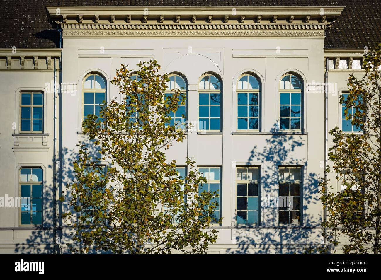 Late sun on the exterior of a white, italian style department store ...