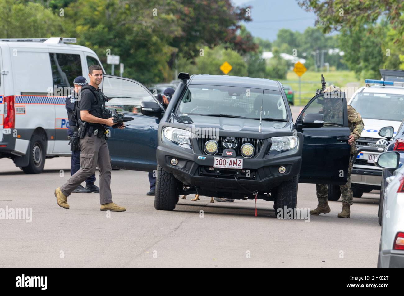 Special Emergency Response Team members and Queensland Police are seen ...