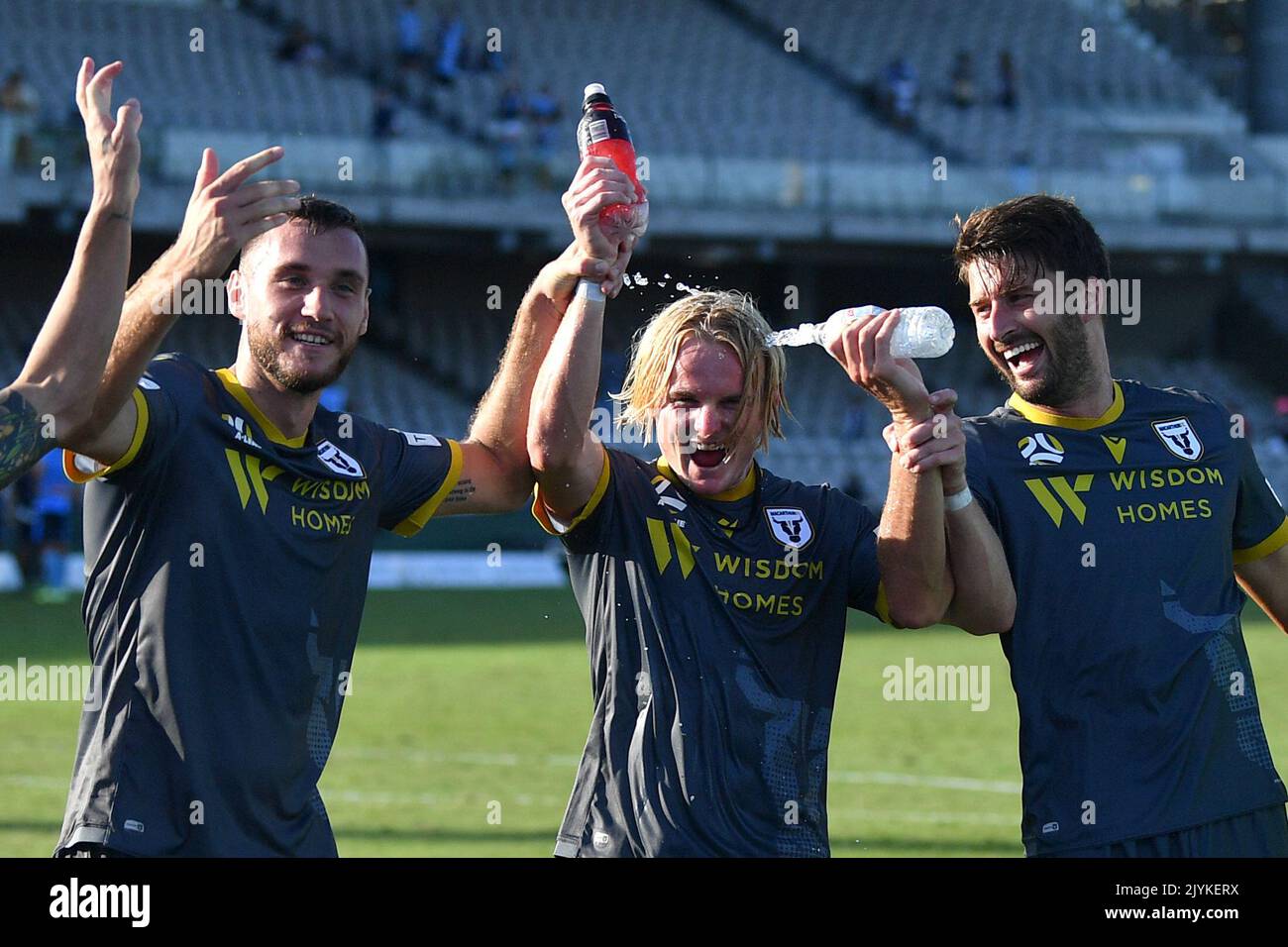 Lachlan Rose of Macarthur FC celebrates victory with fans during the A ...