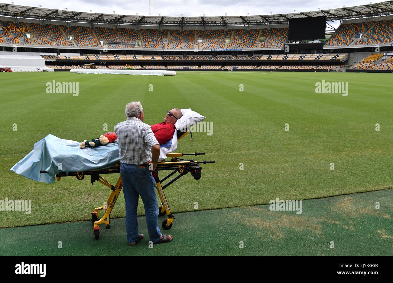 Former Queensland AFL Grand Final hero Ross Whyte (right), who has ...