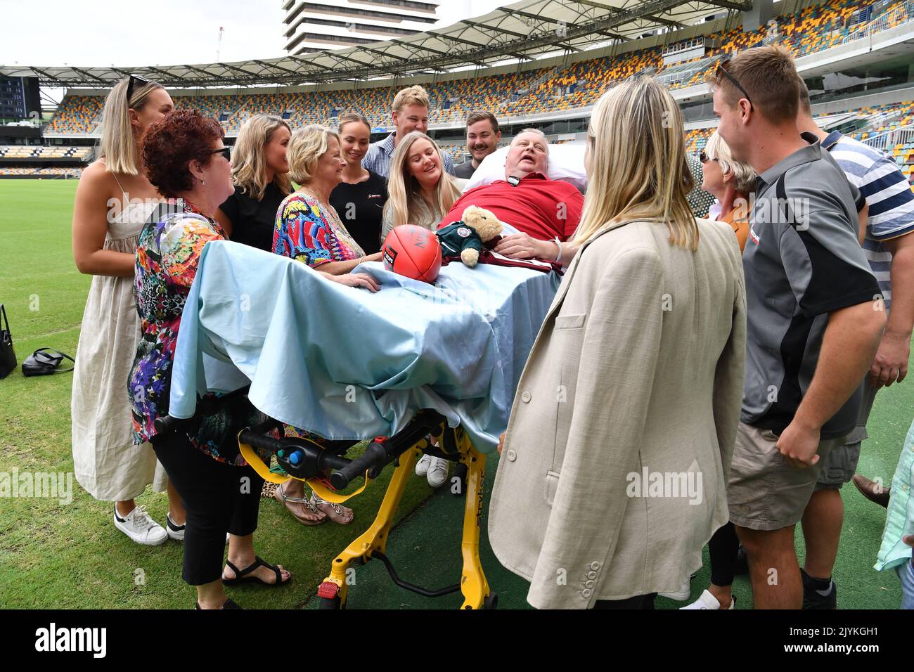 Former Queensland AFL Grand Final hero Ross Whyte (centre), who has ...