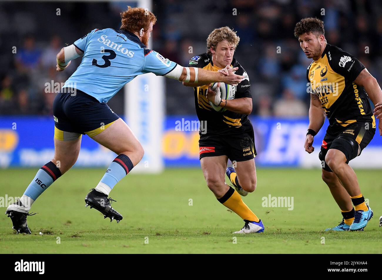 Jake McIntyre of Western Force is tackled by Harry Johnson-Holmes of ...