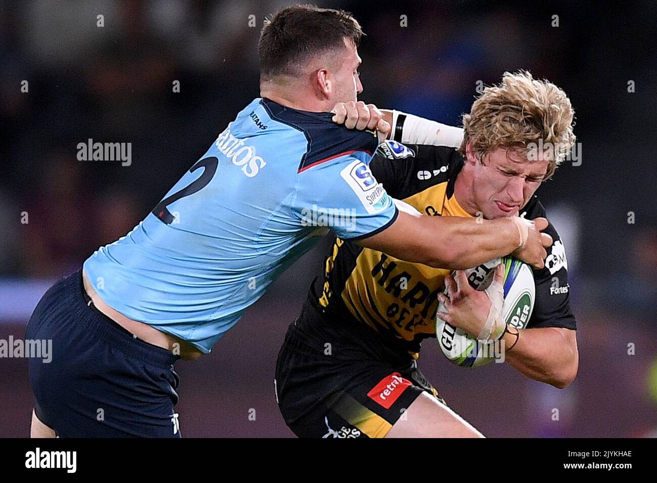 Jake McIntyre of Western Force is tackled by Dave Porecki of the ...