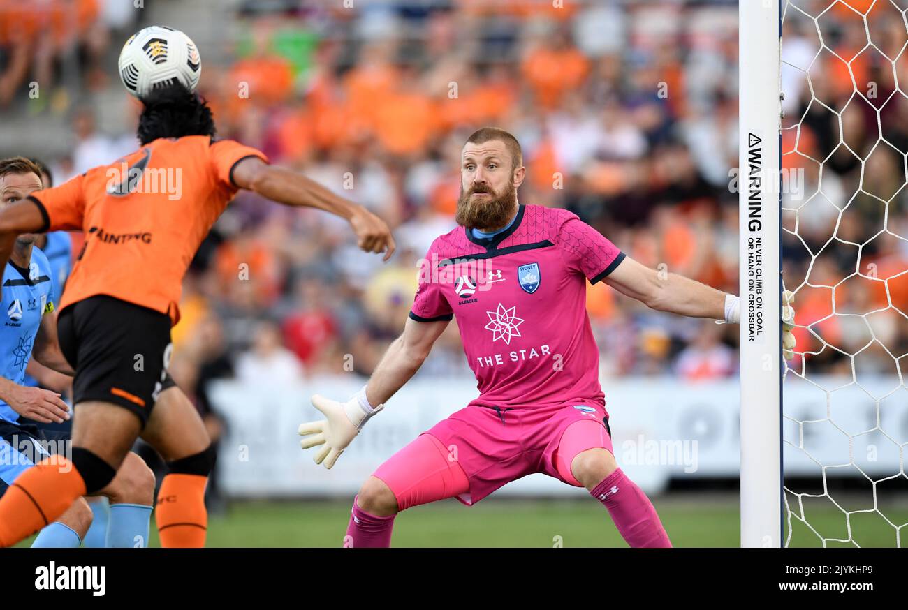 Sydney FC goalkeeper Andrew Redmayne (right) makes a save against ...