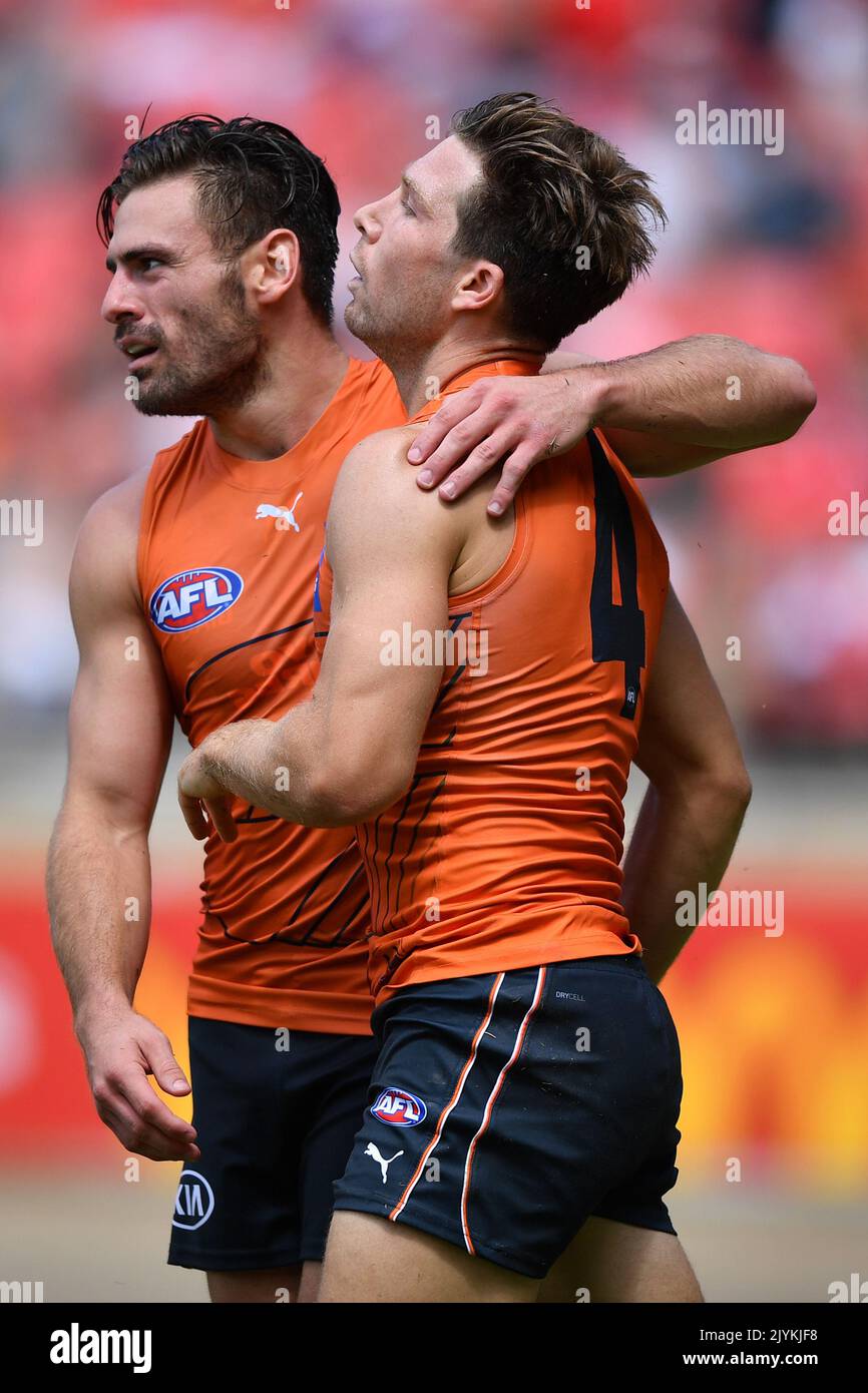 Toby Greene of the Giants celebrates kicking a goal with teammate ...