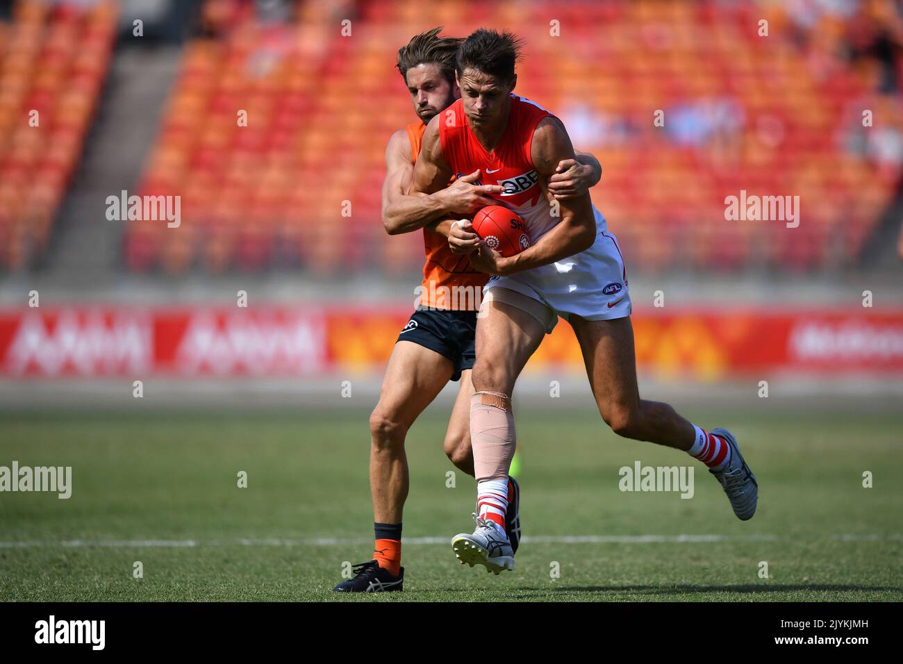 Callan Ward of the Giants and Callum Sinclair of the Swans contest the ...