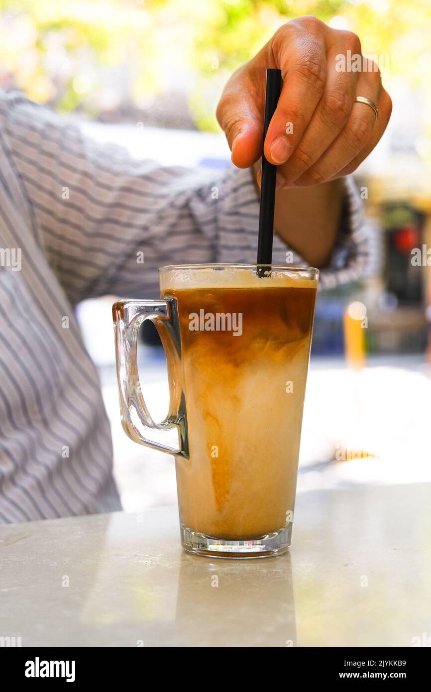 Man drinking iced coffee hi-res stock photography and images - Alamy