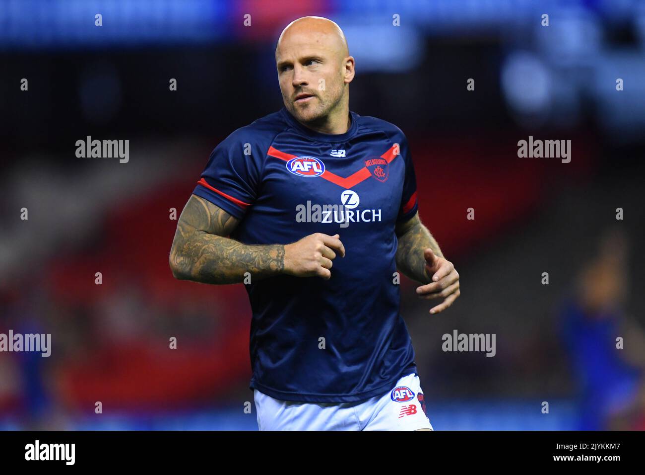Nathan Jones of Melbourne Demons warms up ahead of the Community Series ...