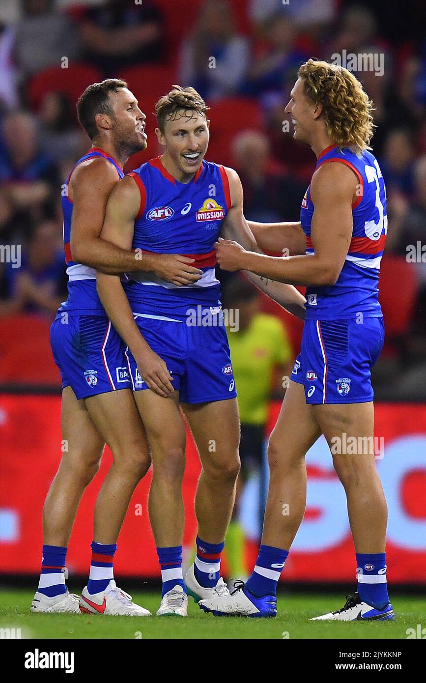 Dale Bailey of Western Bulldogs (centre) celebrates with team mates ...