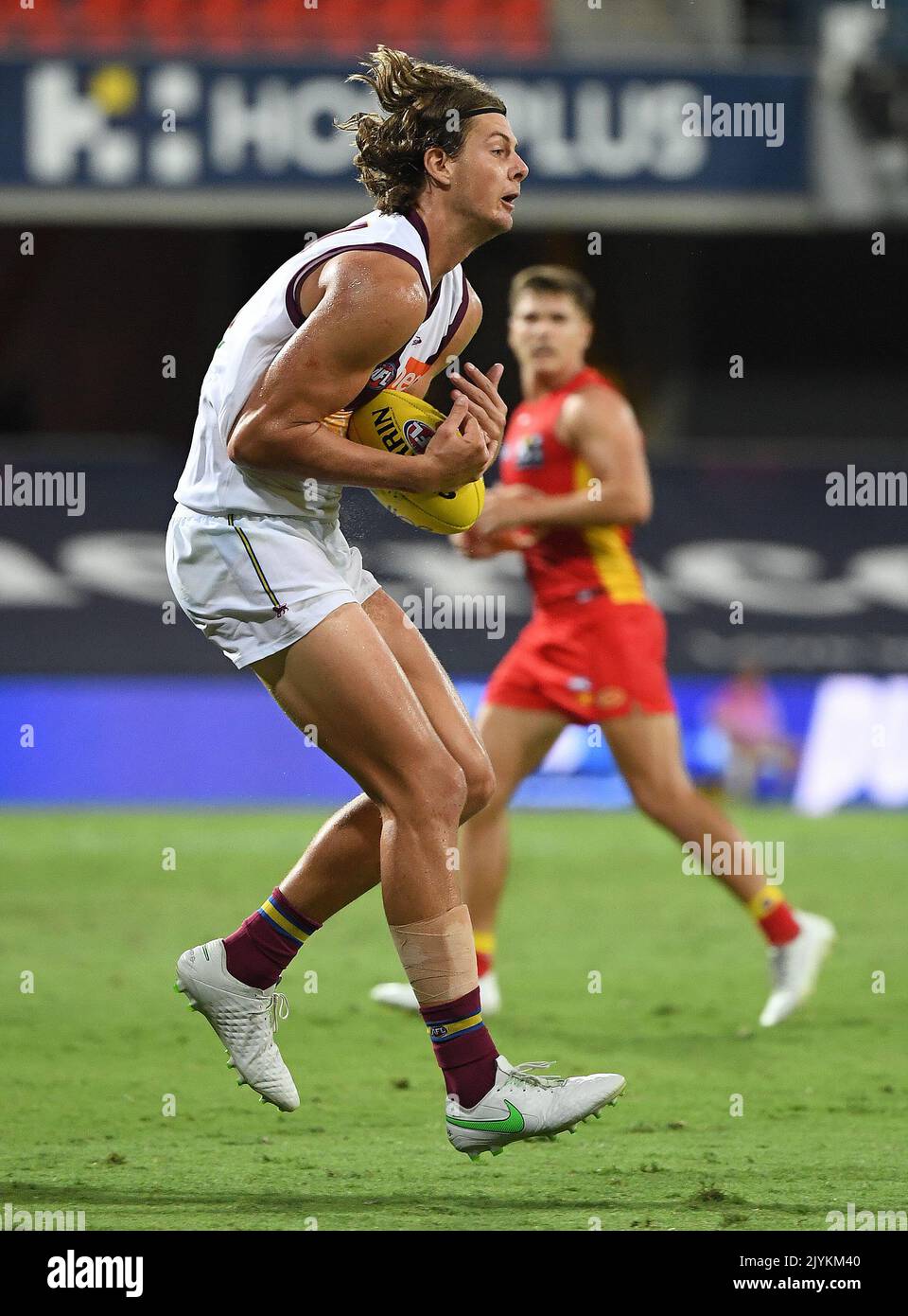 Tom Fullarton of the Lions takes a mark during the Community Series Pre ...