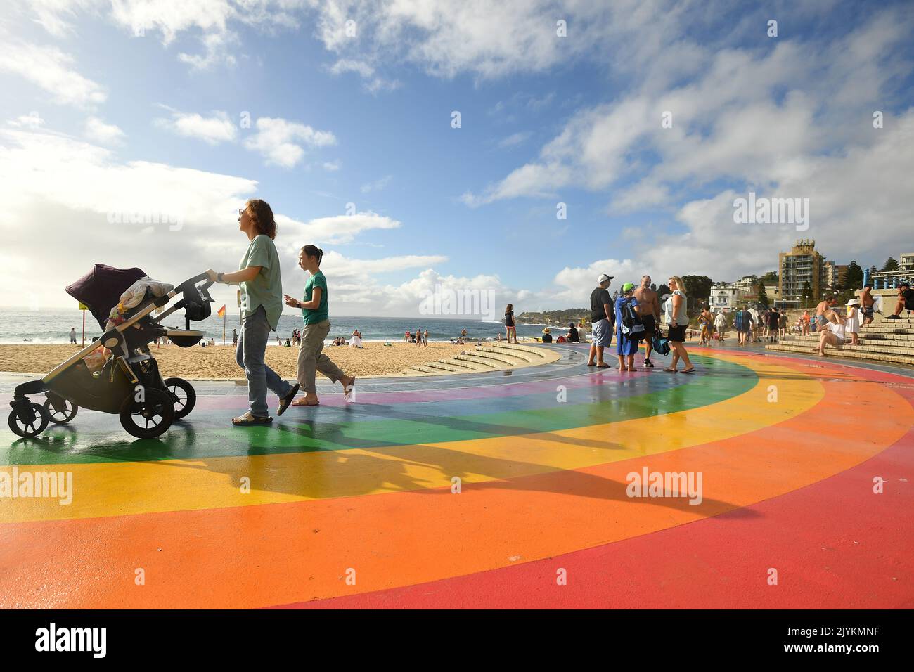 Members of the public use a beachside rainbow walkway to Celebrate ...