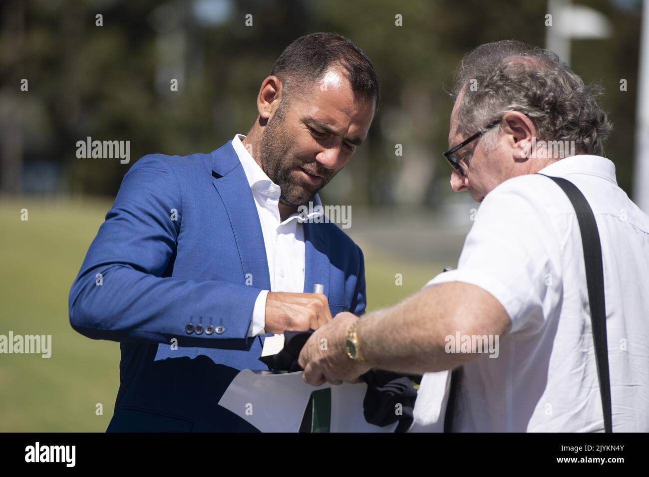 Retiring NRL player Cameron Smith signs an autograph after the ...
