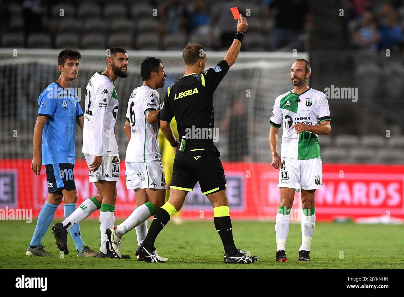 Andrew Durante of Western United (right) is shown a red card and sent ...