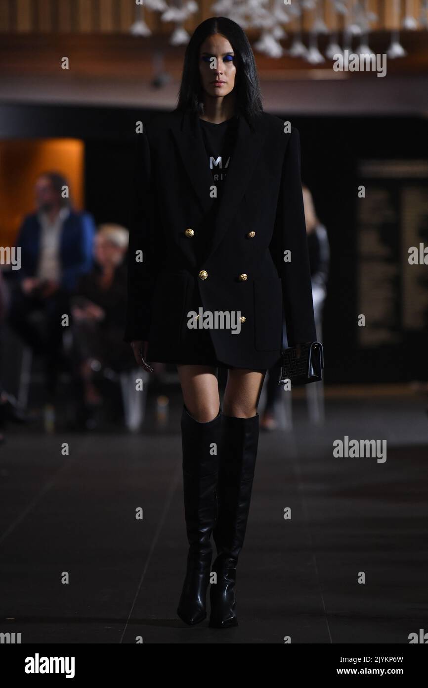 A model walks the runway wearing a design by Balmain during the ...