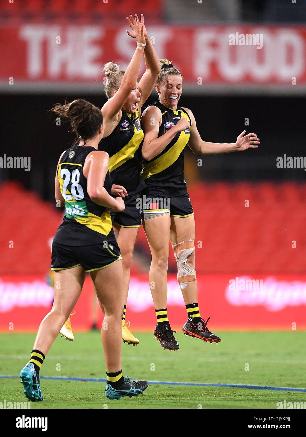 Kodi Jacques reacts with goal scorer Courtney Wakefield of the Tigers ...