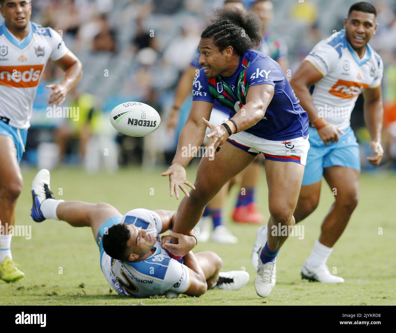 Bunty Afoa of the Warriors offloads during the Round 1 NRL match ...