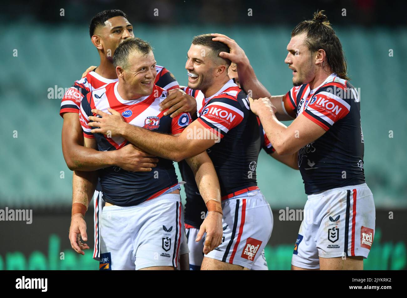 Josh Morris of the Roosters celebrates scoring a try during the Round 1 ...