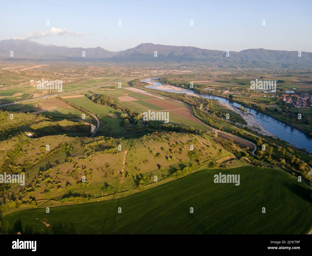 Aerial Sunset view of Struma river passing near village of Topolnitsa, Blagoevgrad region ...