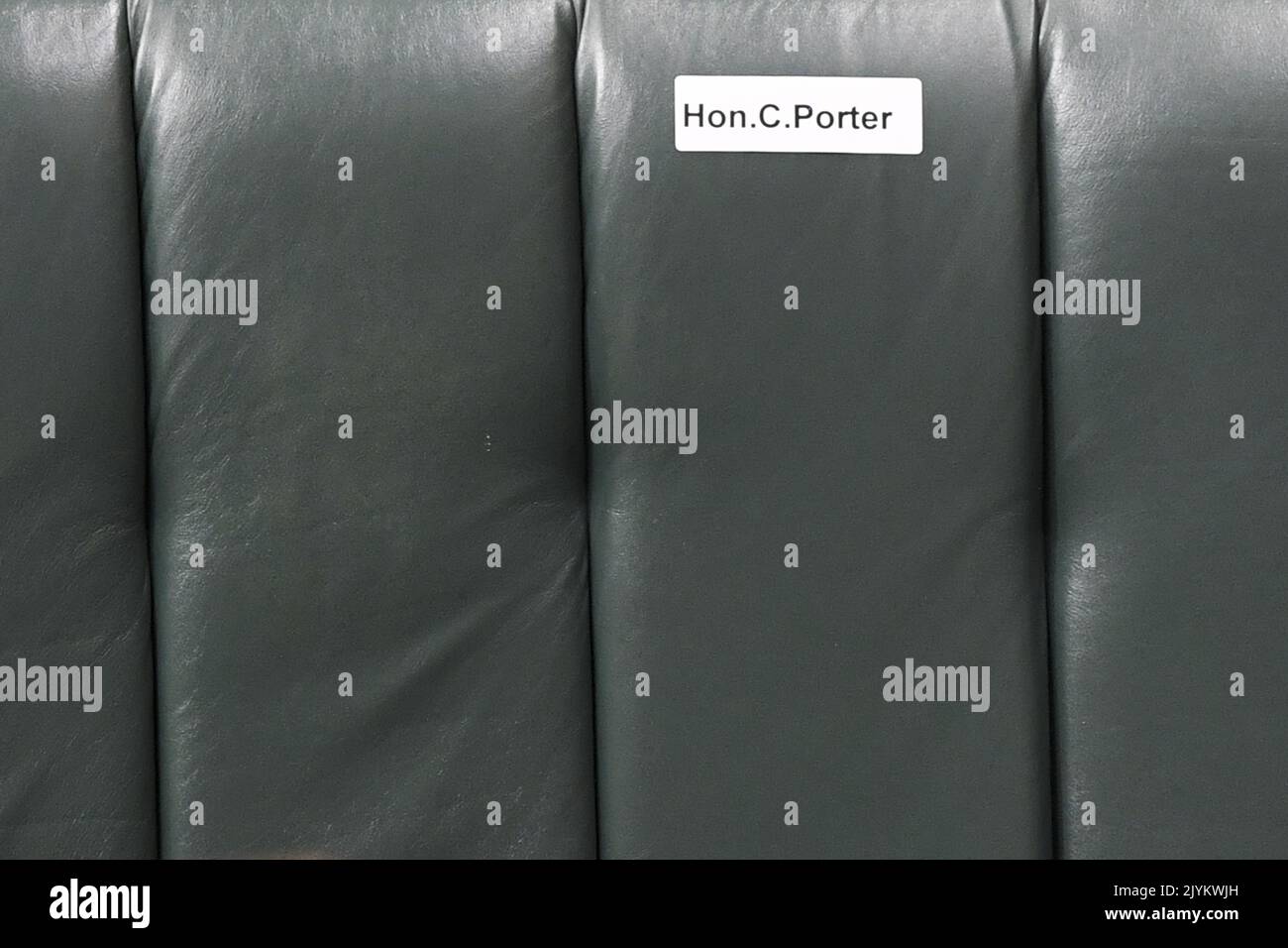 A name tag is seen on an empty seat during House of Representatives ...