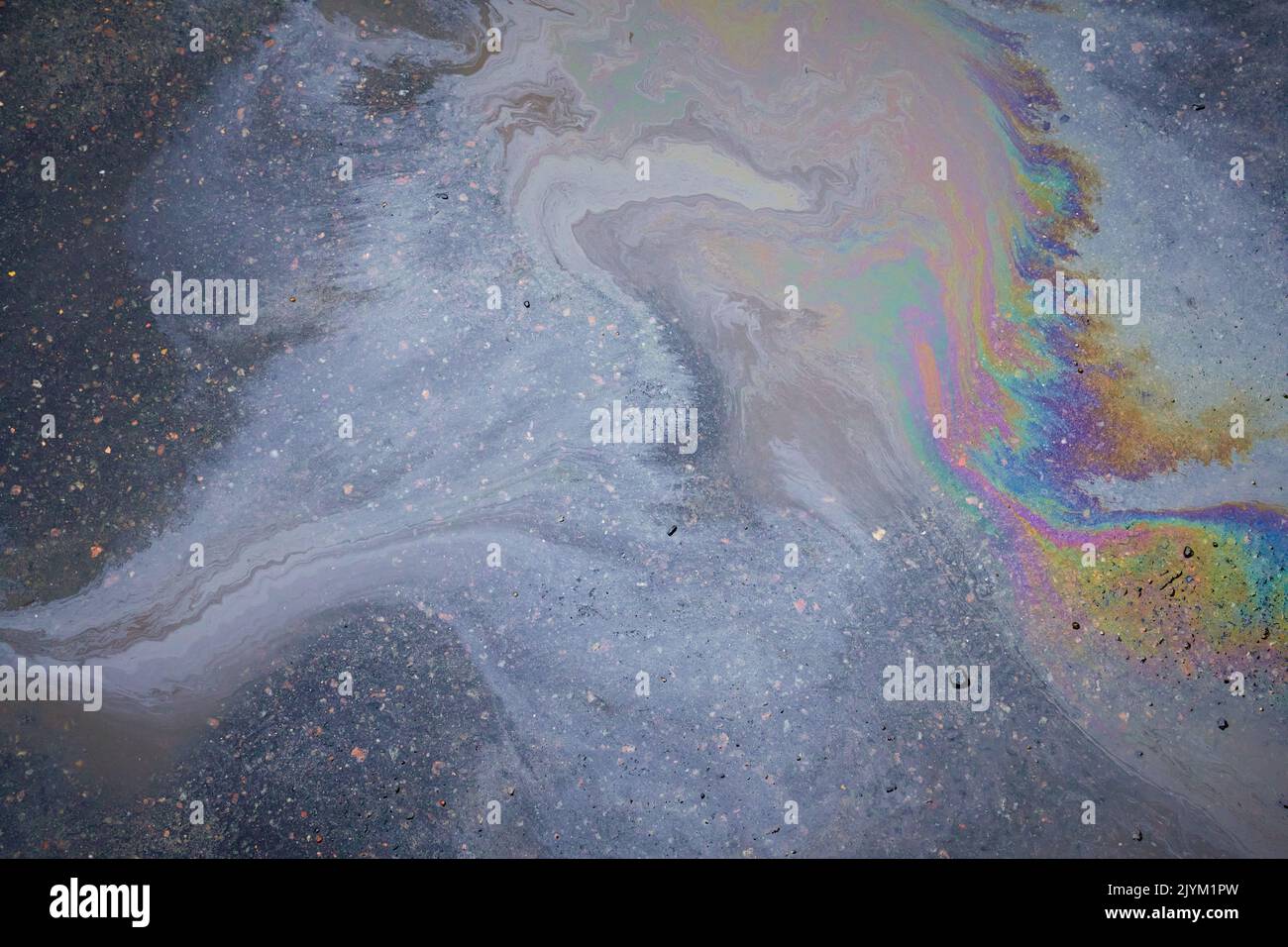 Oil slick on the asphalt road background Stock Photo - Alamy