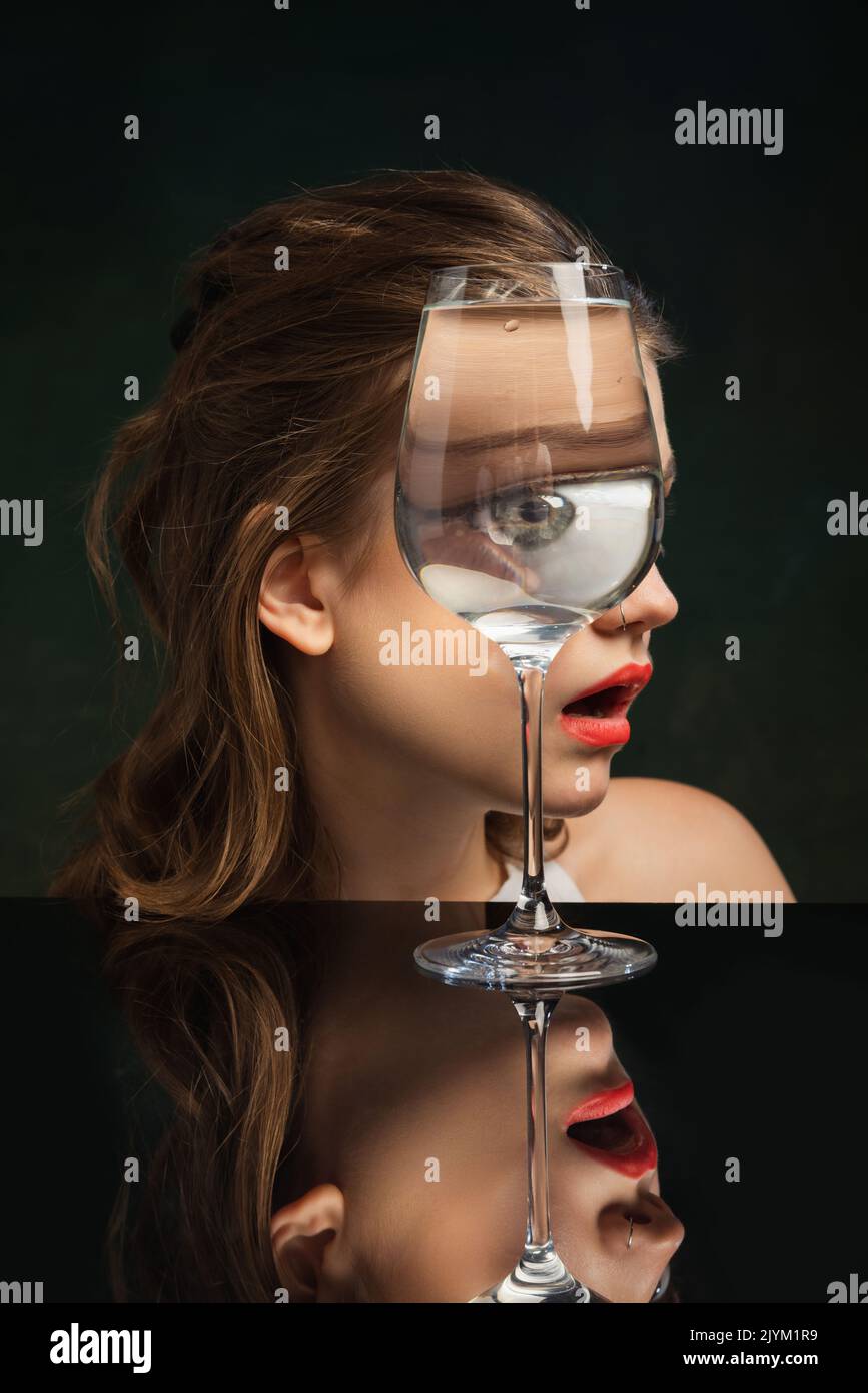Creative art photography. Stylish girl's face through wine glass over ...