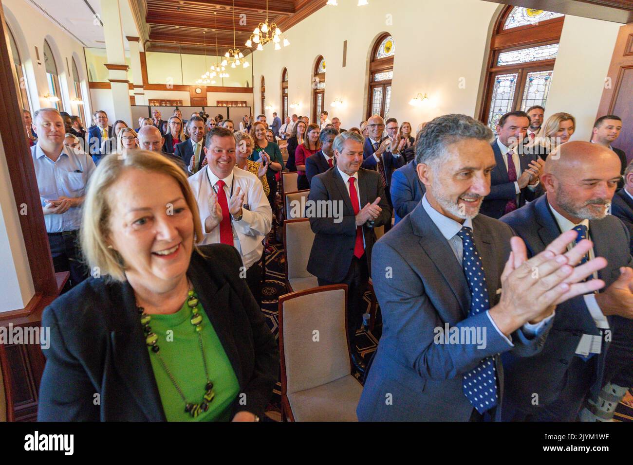 Newly elected members applaud during a speech by Premier-elect West ...