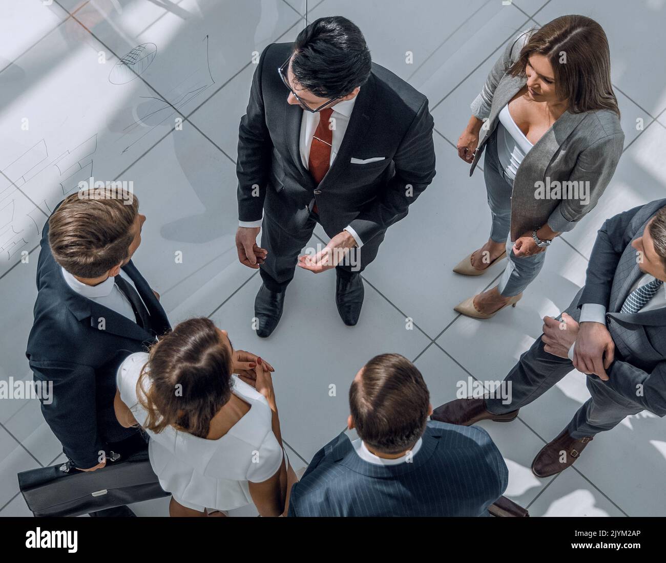 top view. employees standing in a modern office Stock Photo - Alamy