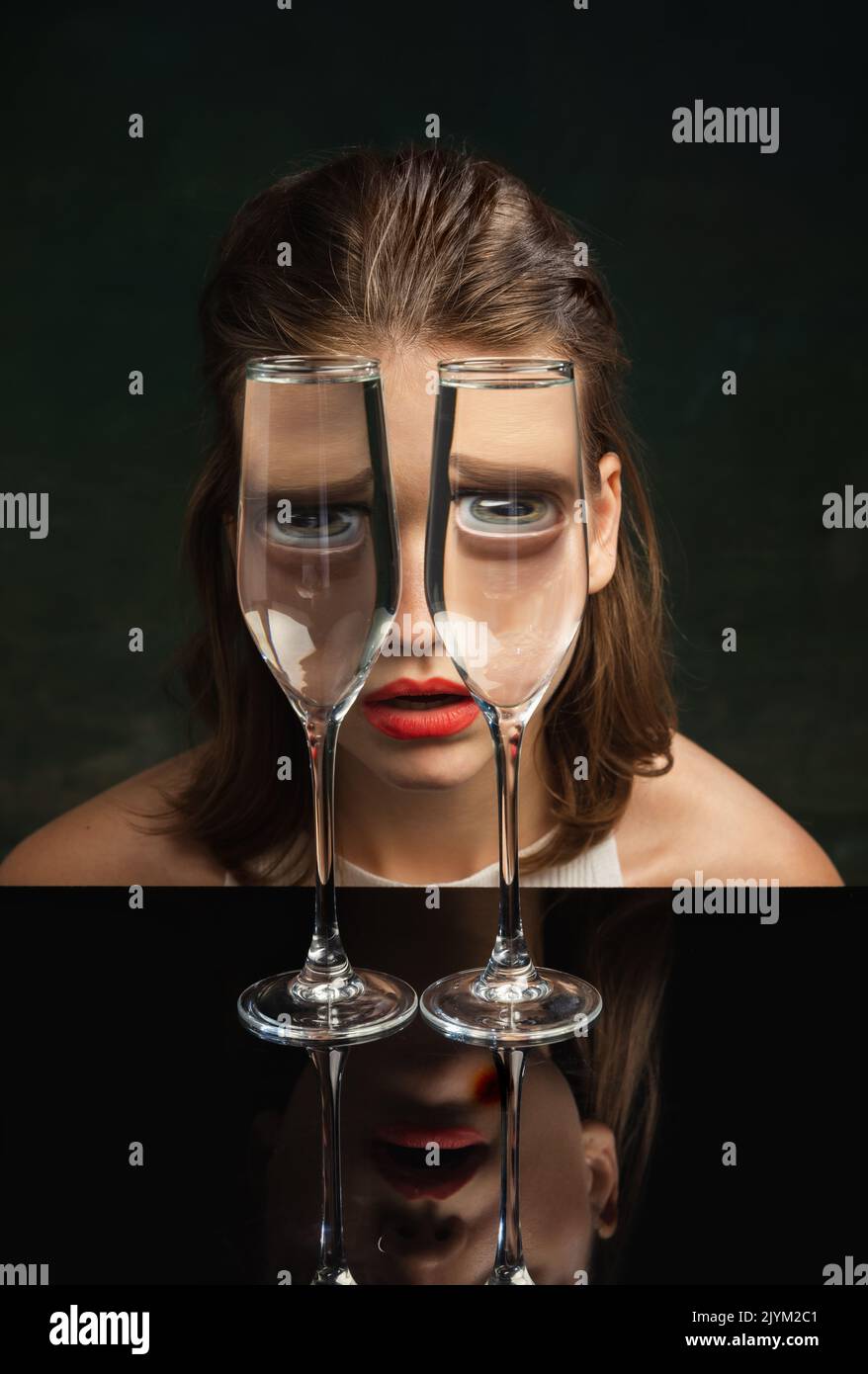 Contemporary art portrait of pretty girl looking through wine glasses ...