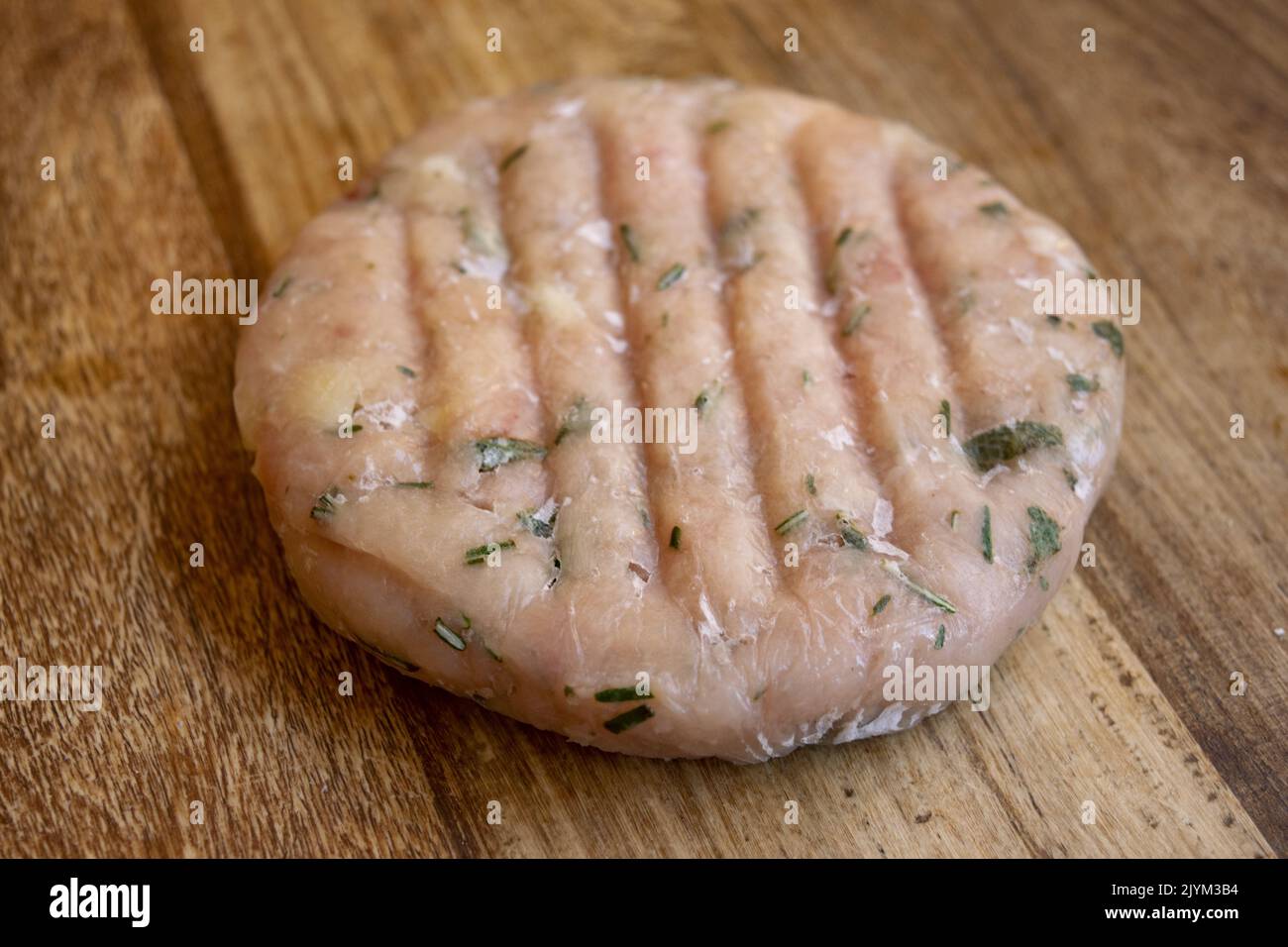 frozen chicken hamburger made at home flavored with herbs Stock Photo ...