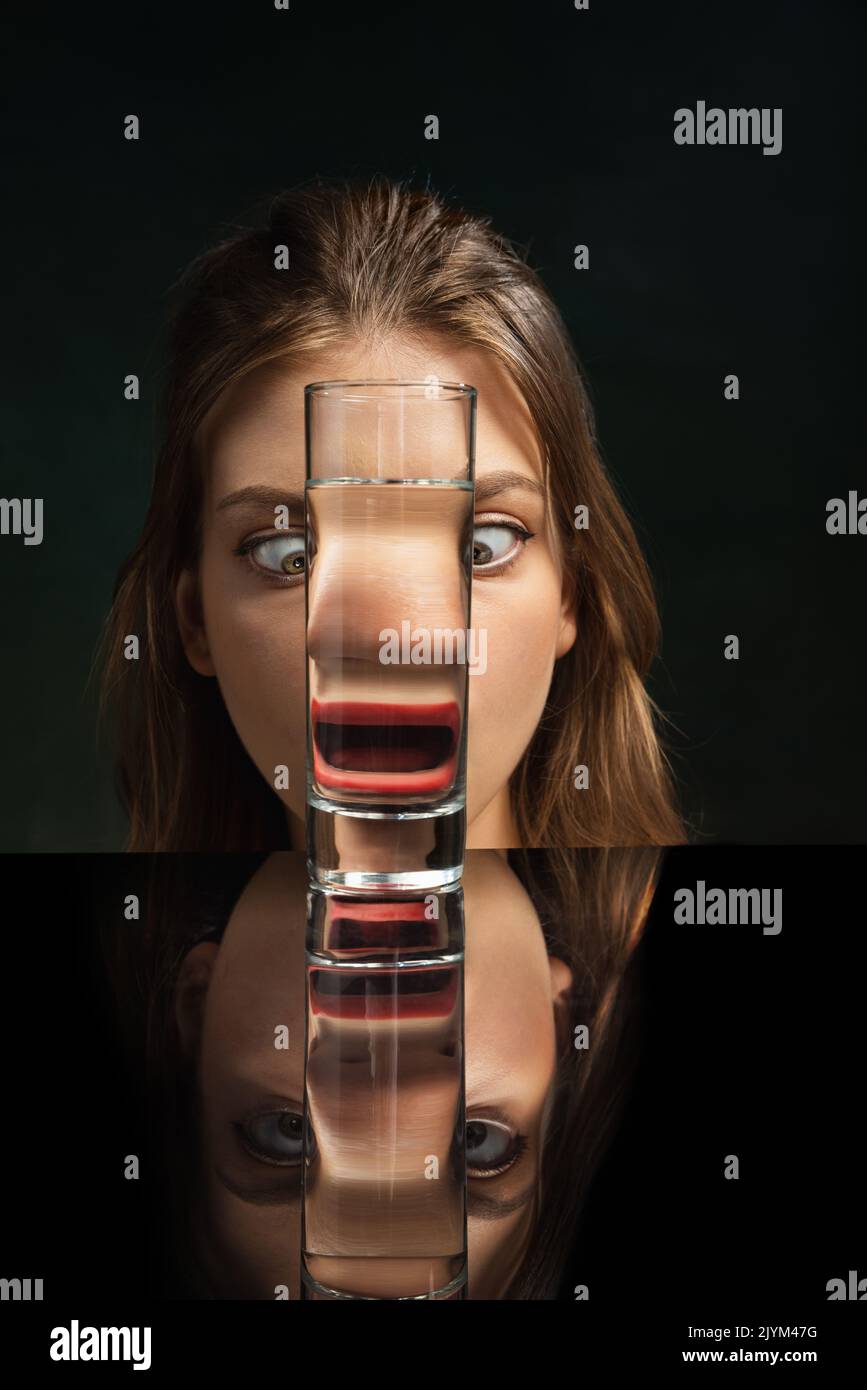 Creative art photography. Stylish girl's face through wine glass over ...