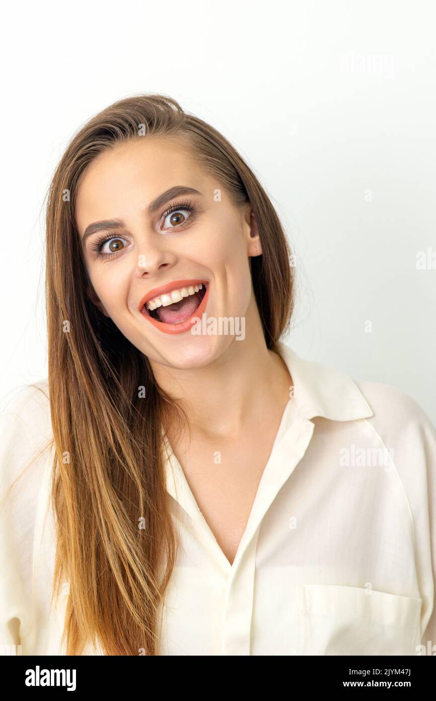 Portrait Of A Young Caucasian Happy Woman Wearing White Shirt Smiling