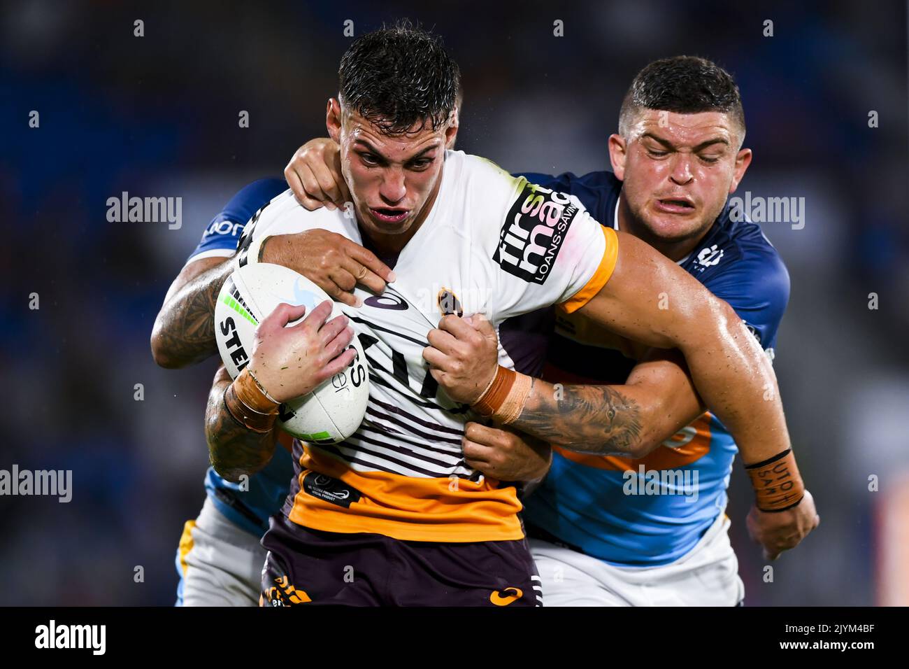 Jordan Riki of the Broncos is tackled during the Round 2 NRL match ...