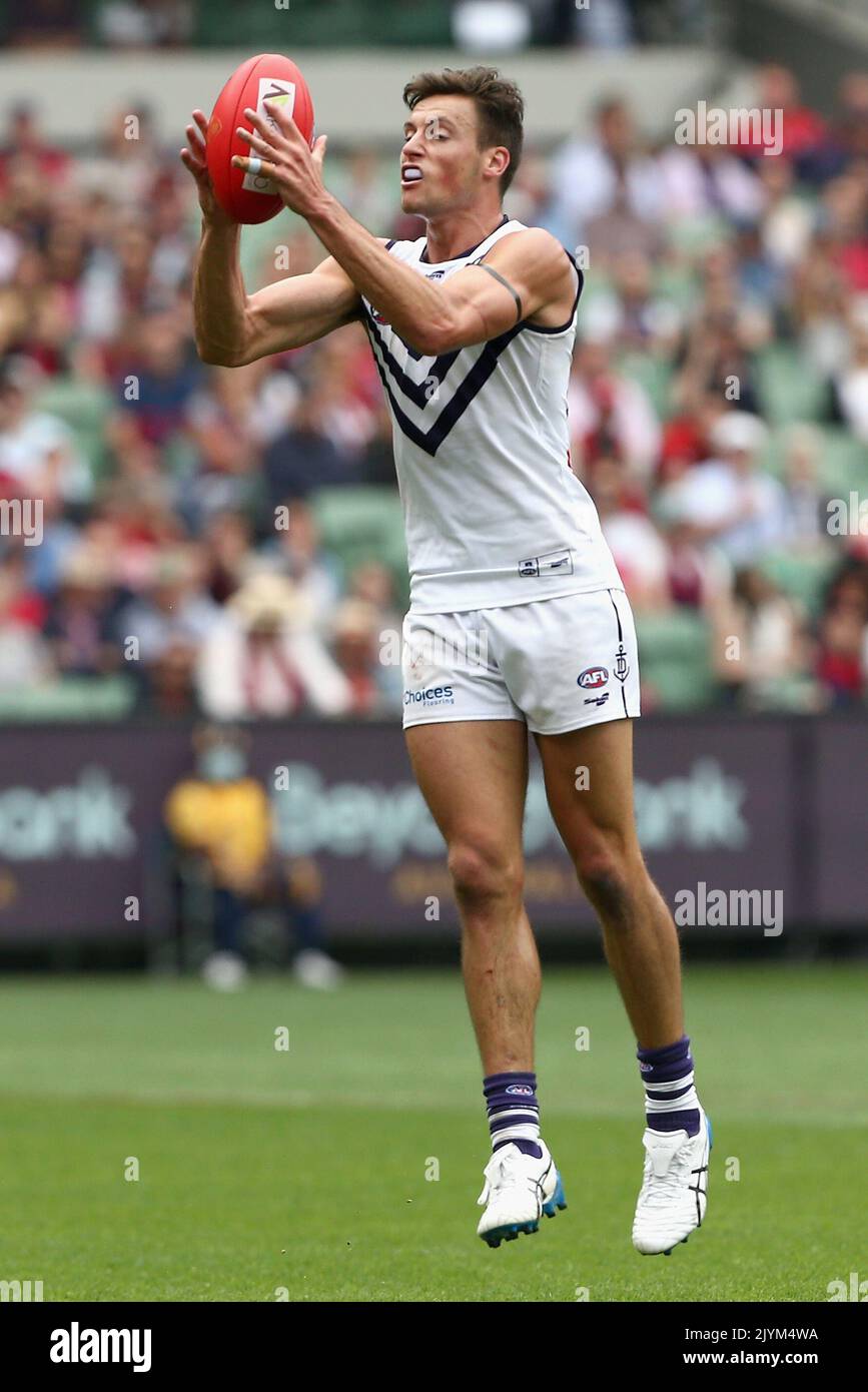 Ethan Hughes of the Dockers takes a mark during the Round 1 AFL match ...