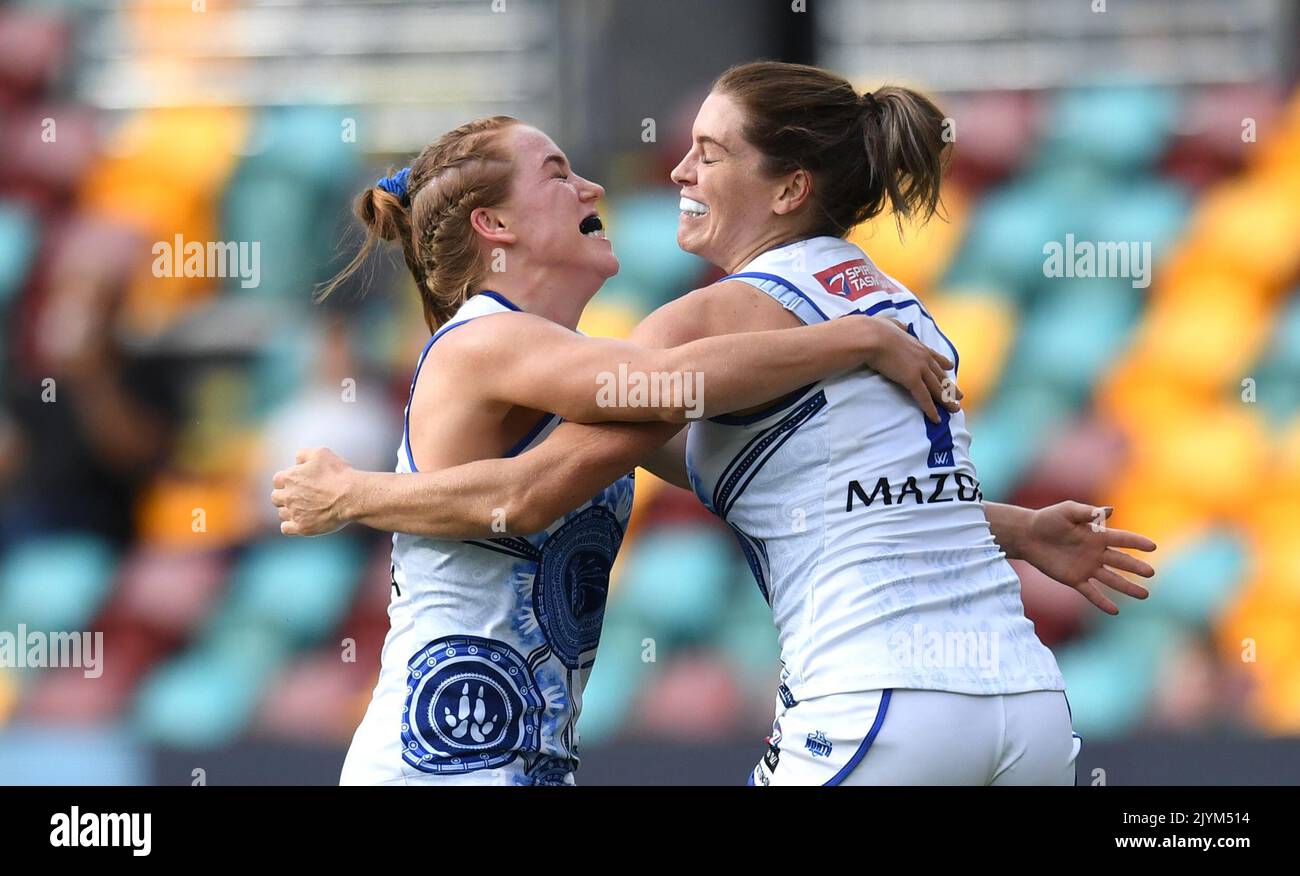 Sophie Abbatangelo (right) of the Kangaroos celebrates kicking a goal ...