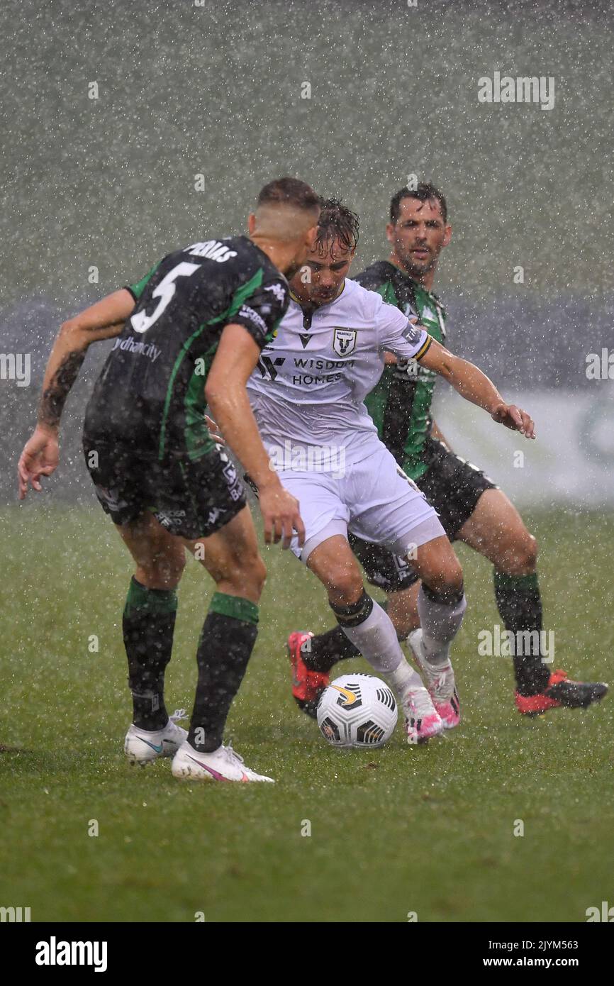 Denis Genreau of Macarthur and Dylan Pierias of Western United during ...