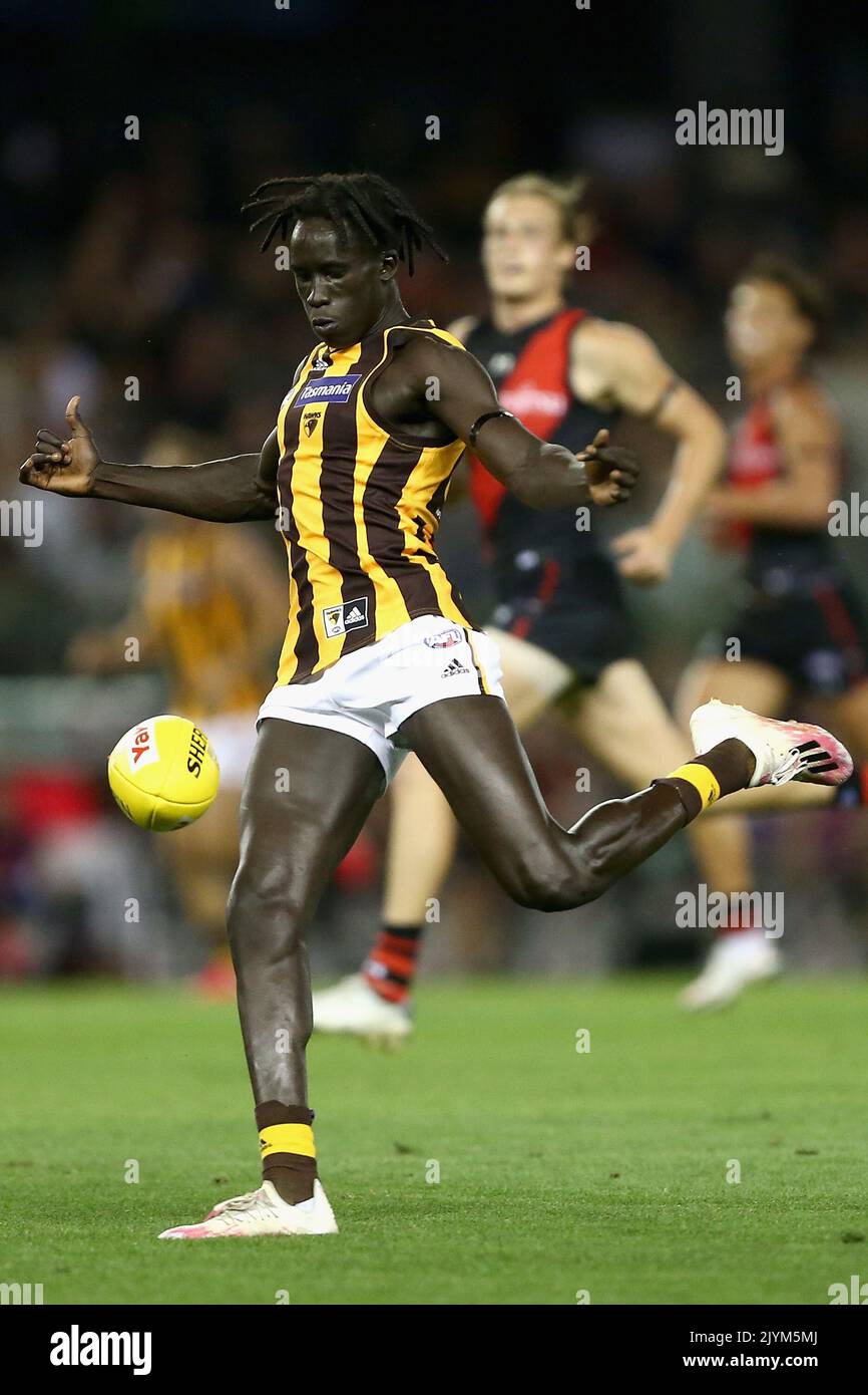 Changkuoth Jiath of the Hawks kicks the ball during the Round 1 AFL ...