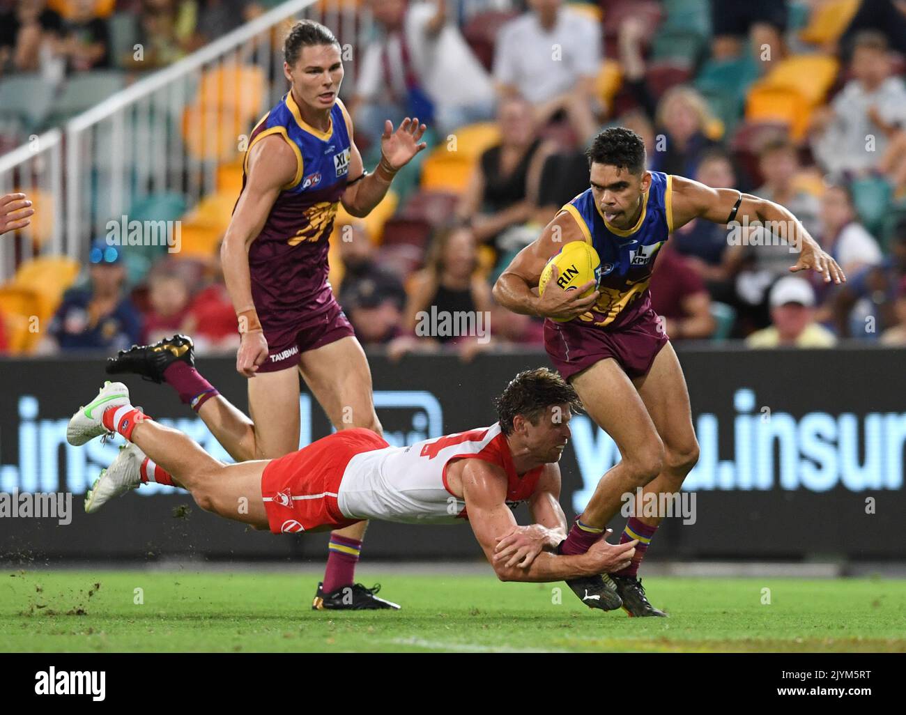 Charlie Cameron (right) of the Lions gets past Dane Rampe (left) of the ...