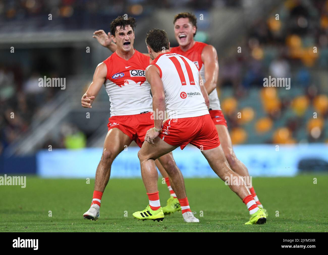 Tom Papley (left) of the Swans celebrates kicking a goal with Sam Wicks ...