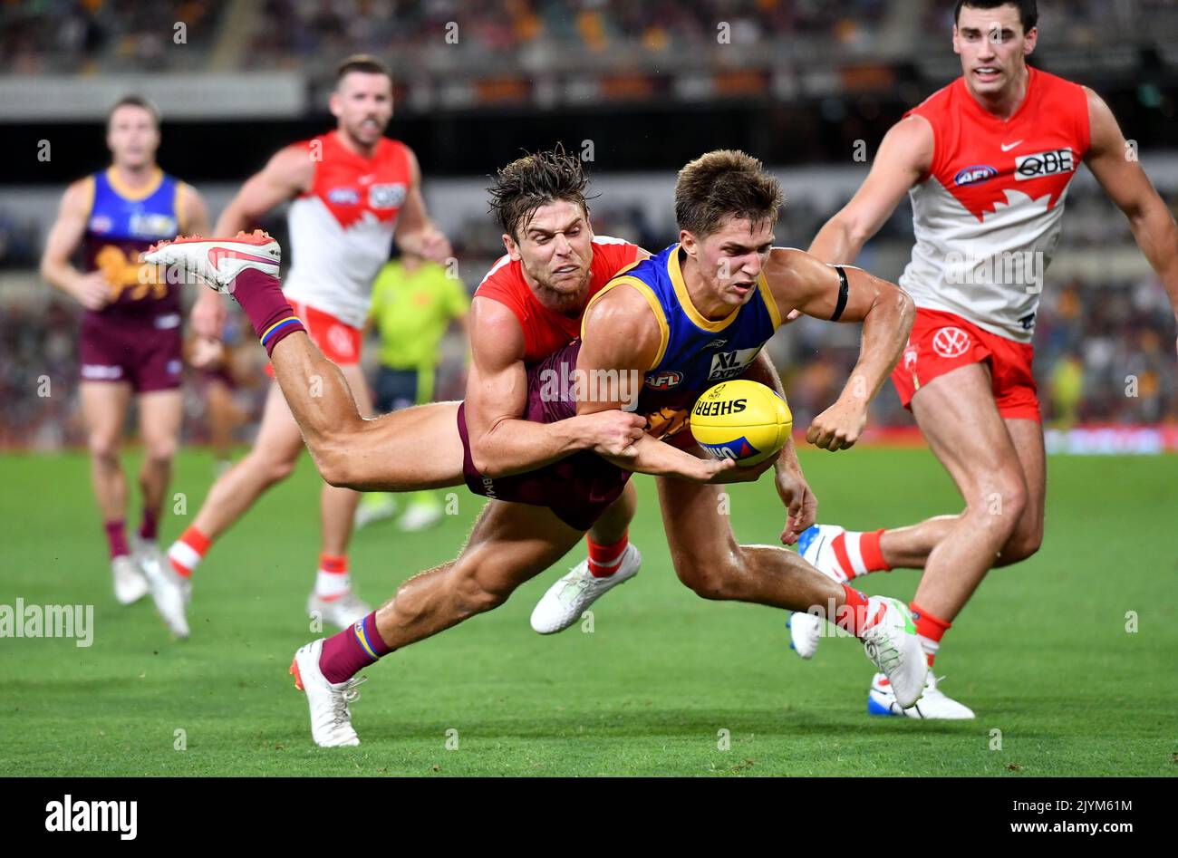 Zac Bailey (right) of the Lions is tackled by Dane Rampe (left) of the ...