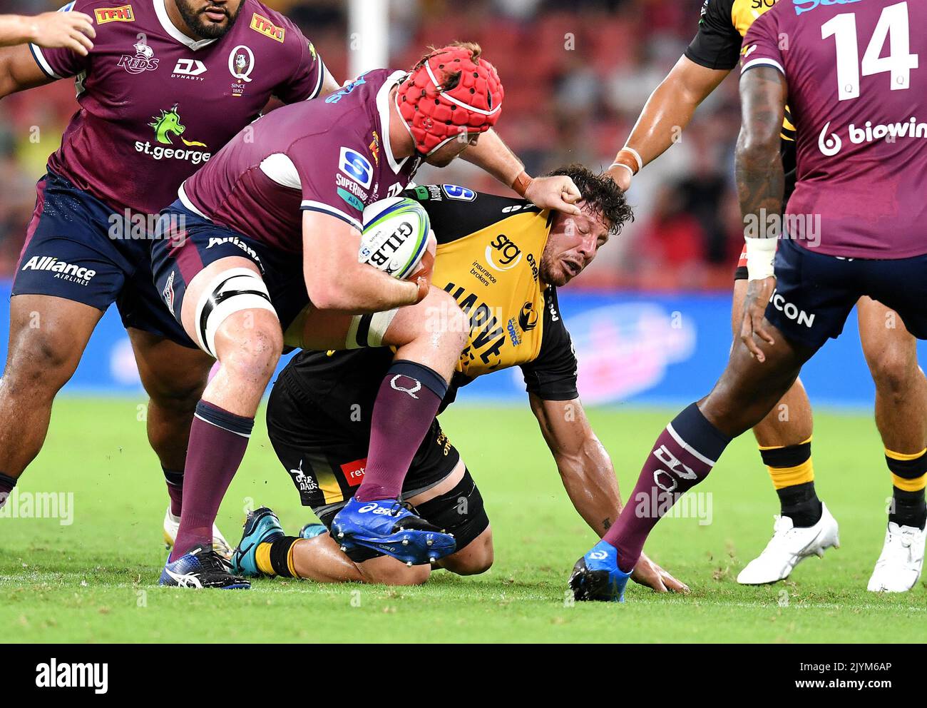 Harry Wilson of the Reds (left) tackles Brynard Stander of the Force ...