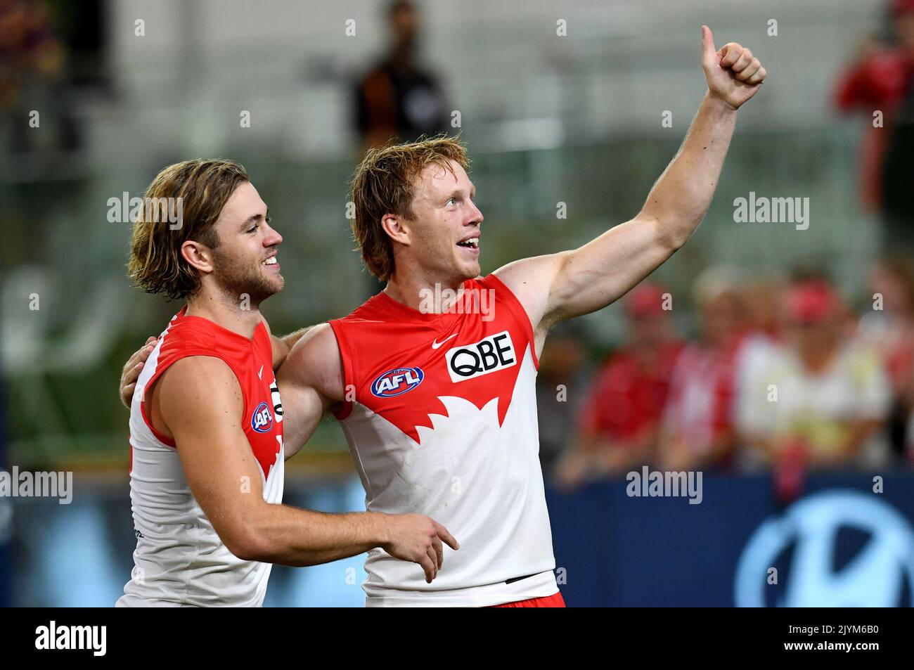 Callum Mills (right) of the Swans celebrates winning with James ...