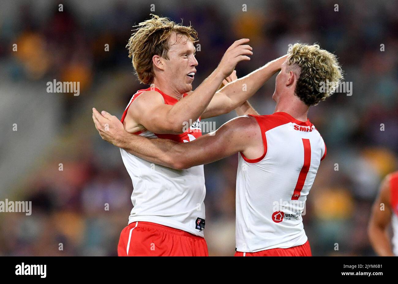 Callum Mills (left) of the Swans celebrates kicking a goal with Chad ...