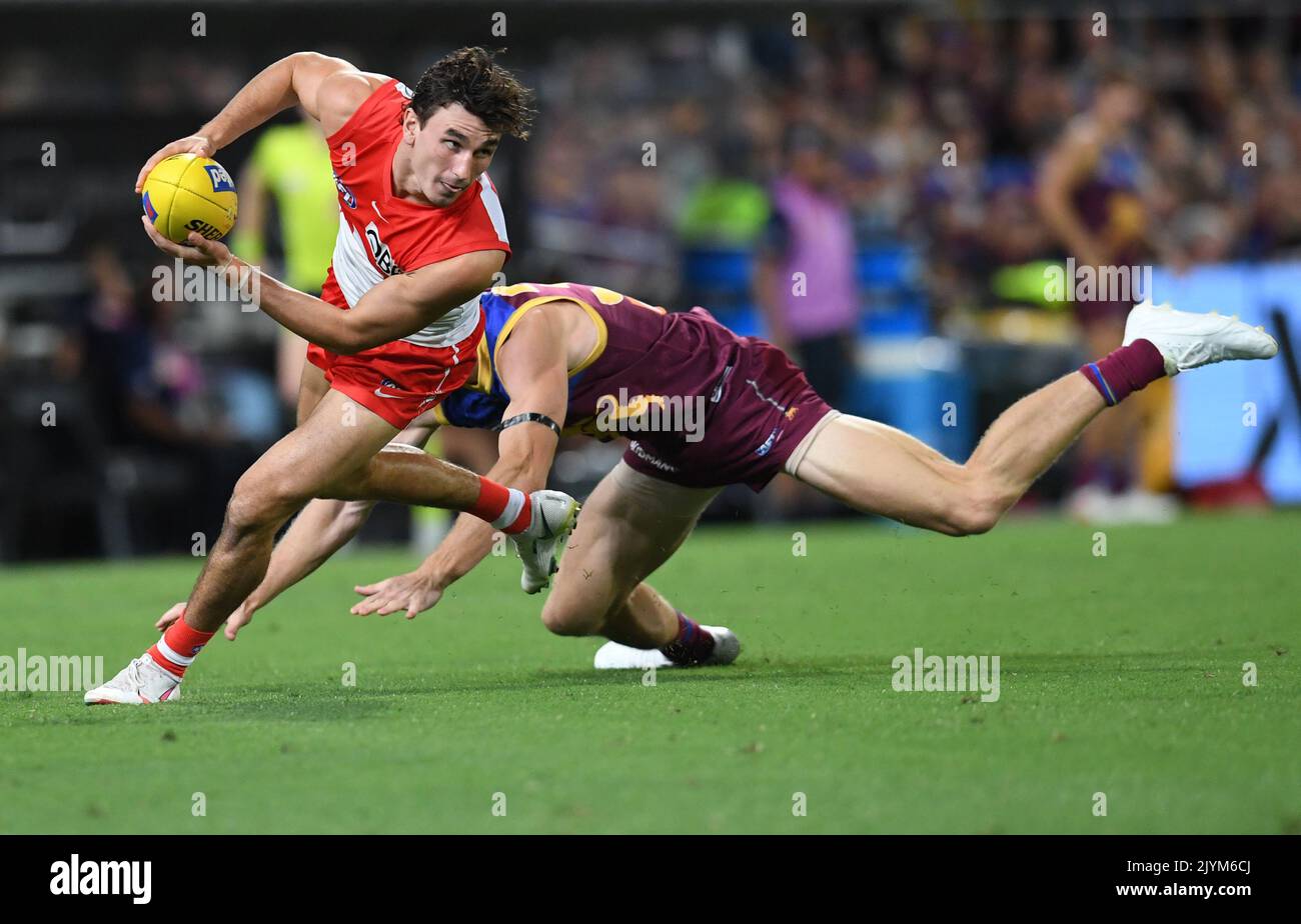 Sam Wicks (left) of the Swans gets past Ryan Lester (right) of the ...