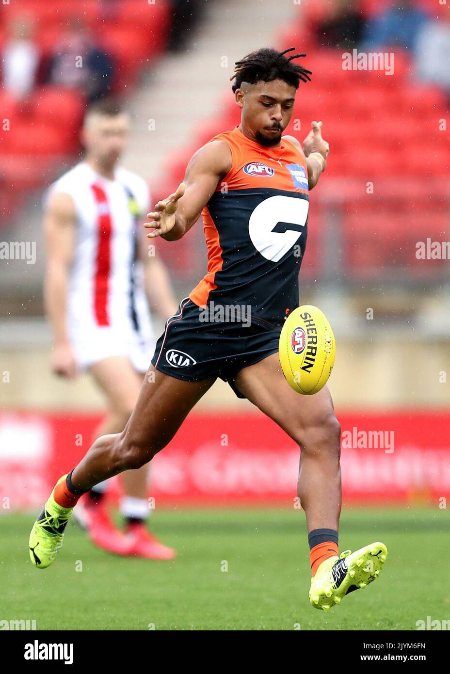 Connor Idun of the Giants kicks during the Round 1 AFL match between ...