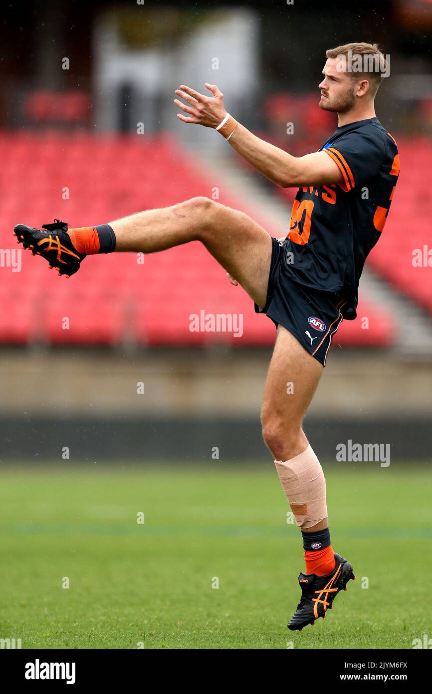 Matt Flynn of the Giants warms up prior to the Round 1 AFL match ...