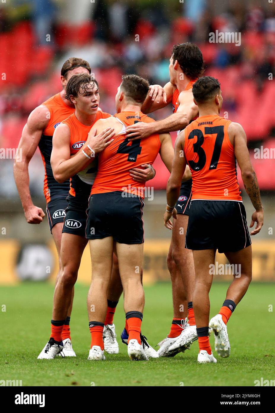 Toby Greene of the Giants celebrates kicking a goal with team mates ...