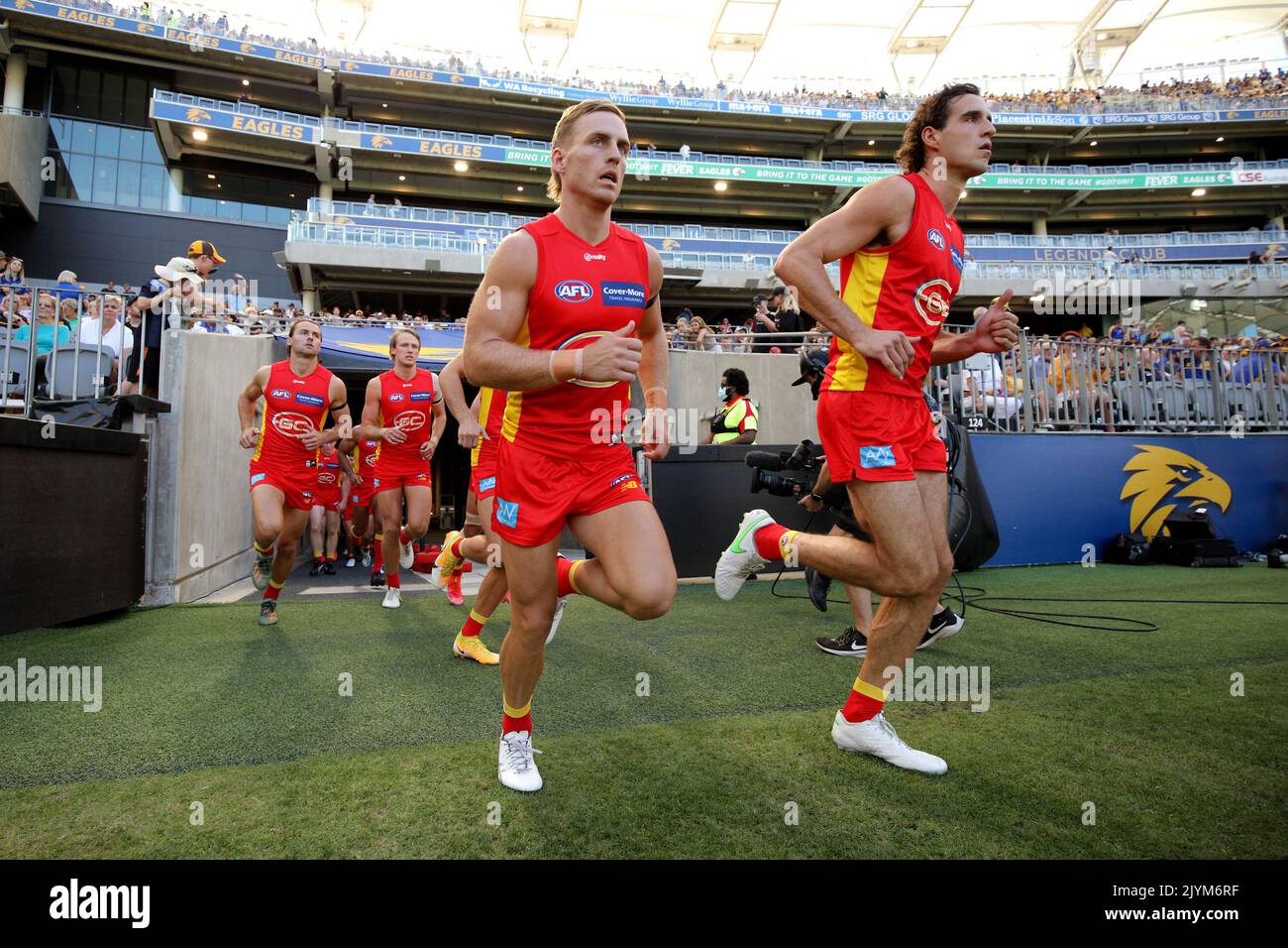 Gold Coast Suns players enter the field at the start of the Round 1 AFL ...