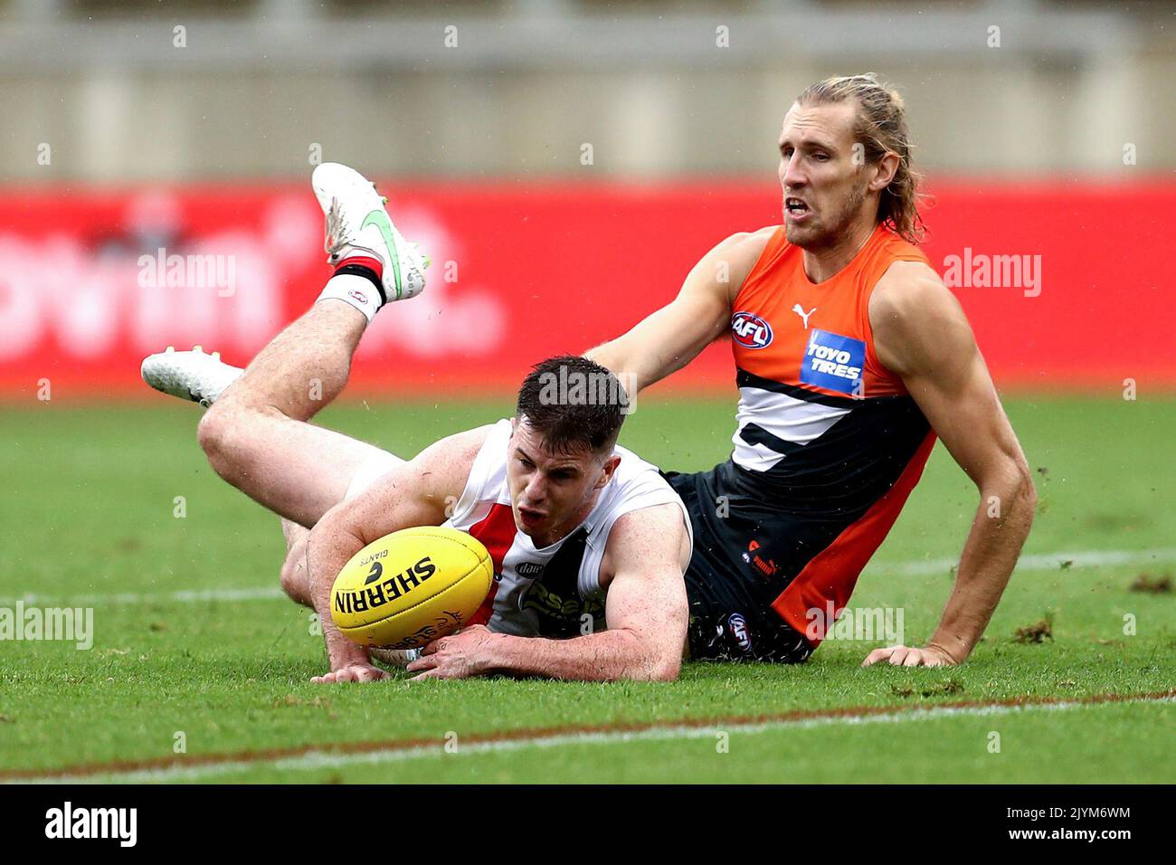 Jack Higgins of the Saints contests the ball with Nick Hayes of the ...