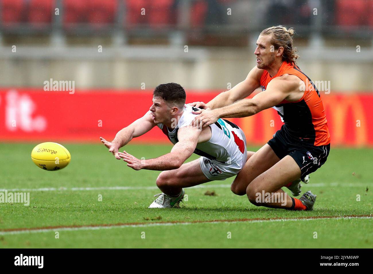 Jack Higgins of the Saints contests the ball with Nick Hayes of the ...